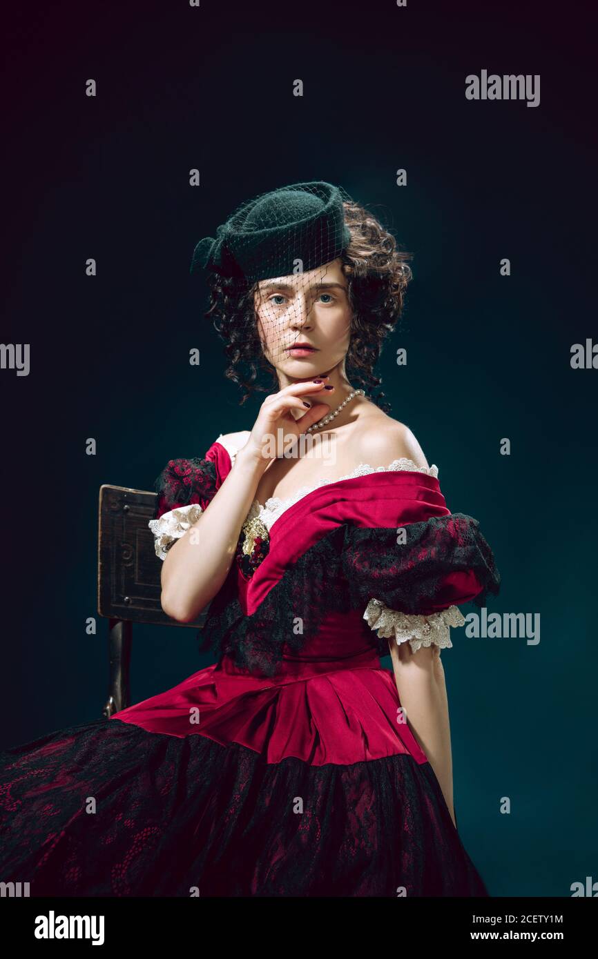 Love tragic. Young woman as Anna Karenina isolated on dark blue ...