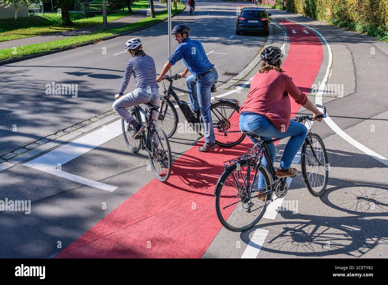 A lot of traffic at a cycle path intersection with other traffic ...