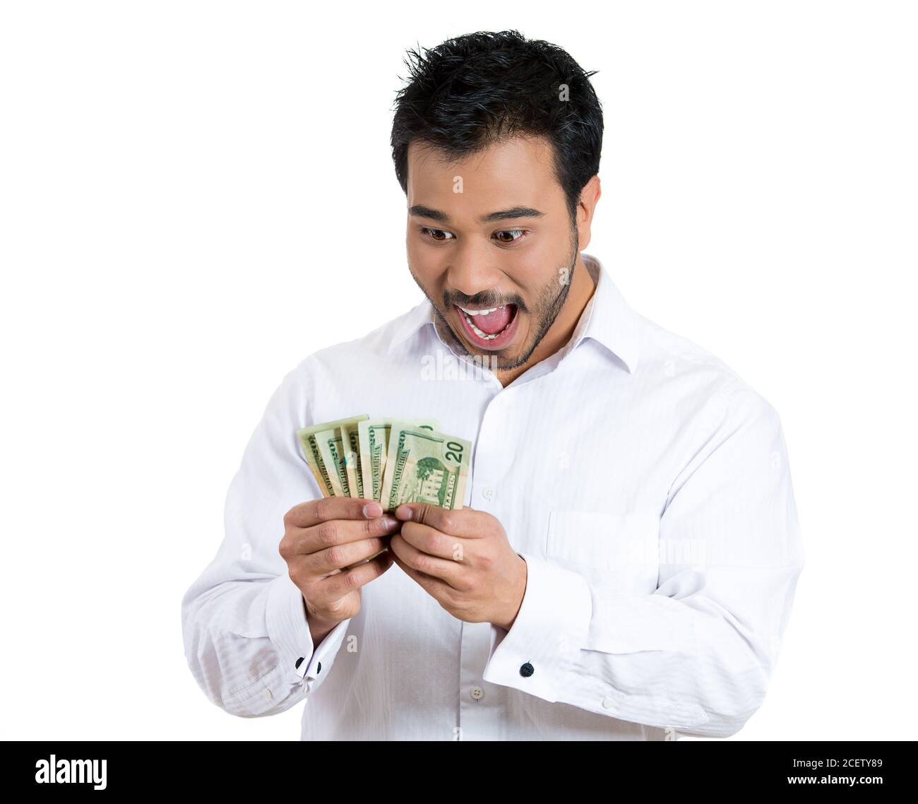 Closeup portrait, super happy excited successful young man holding ...