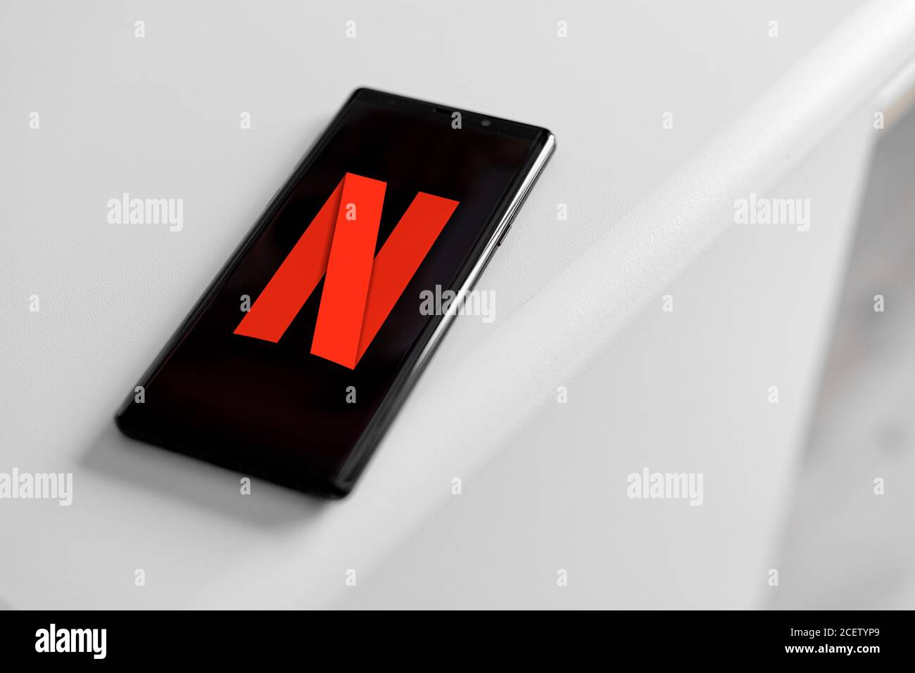 Netflix company logo on the smartphone screen Stock Photo - Alamy