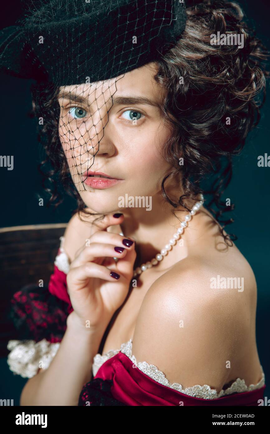 Love tragic. Young woman as Anna Karenina isolated on dark blue ...