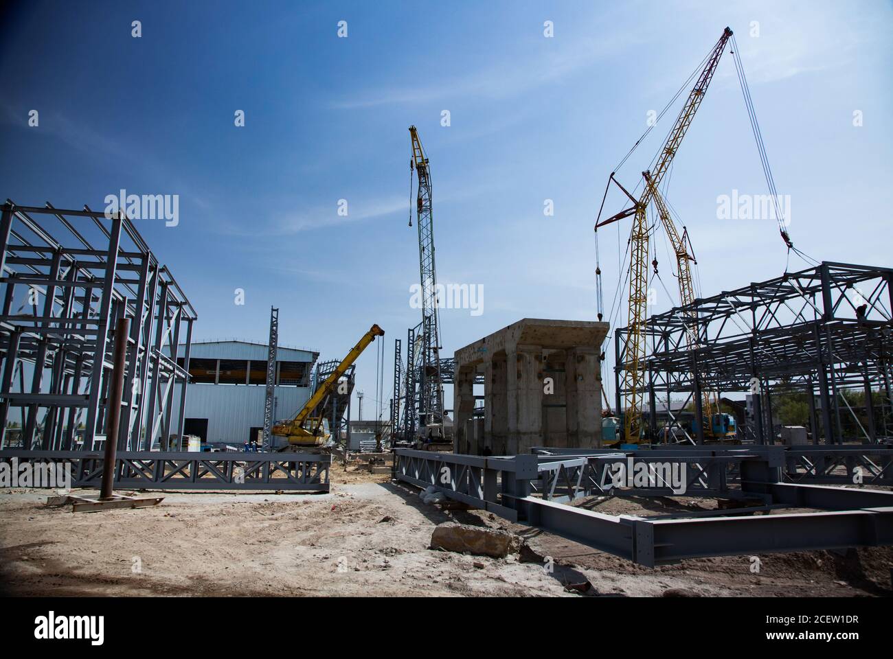 Girder cranes and grey metal grating constructions and concrete support ...