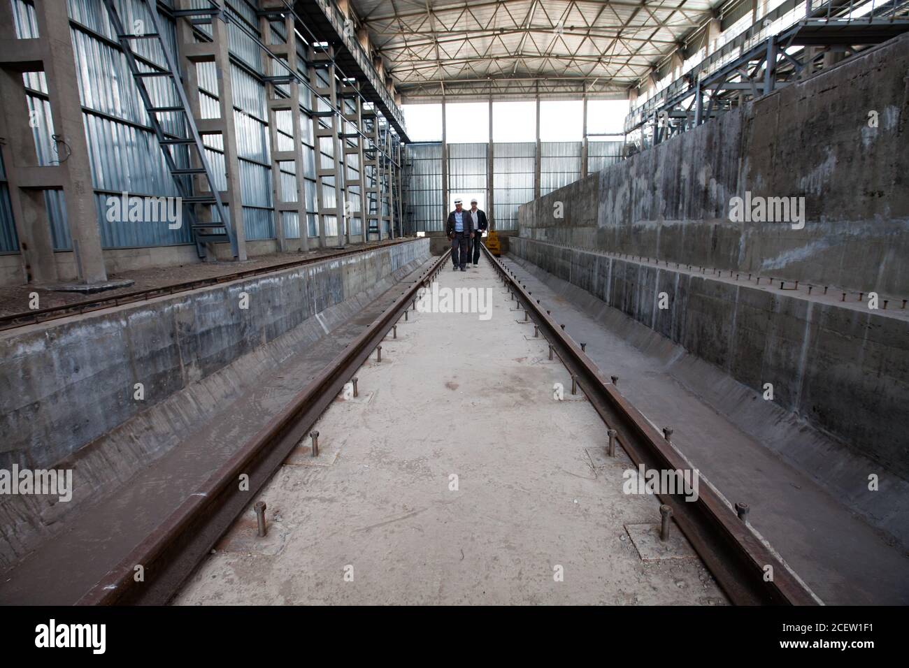 Grey concrete interior of new industrial building. Phosphoric ...