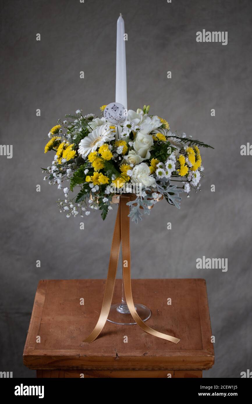 First holy communion flower bouquets. White candle decorated with white ...
