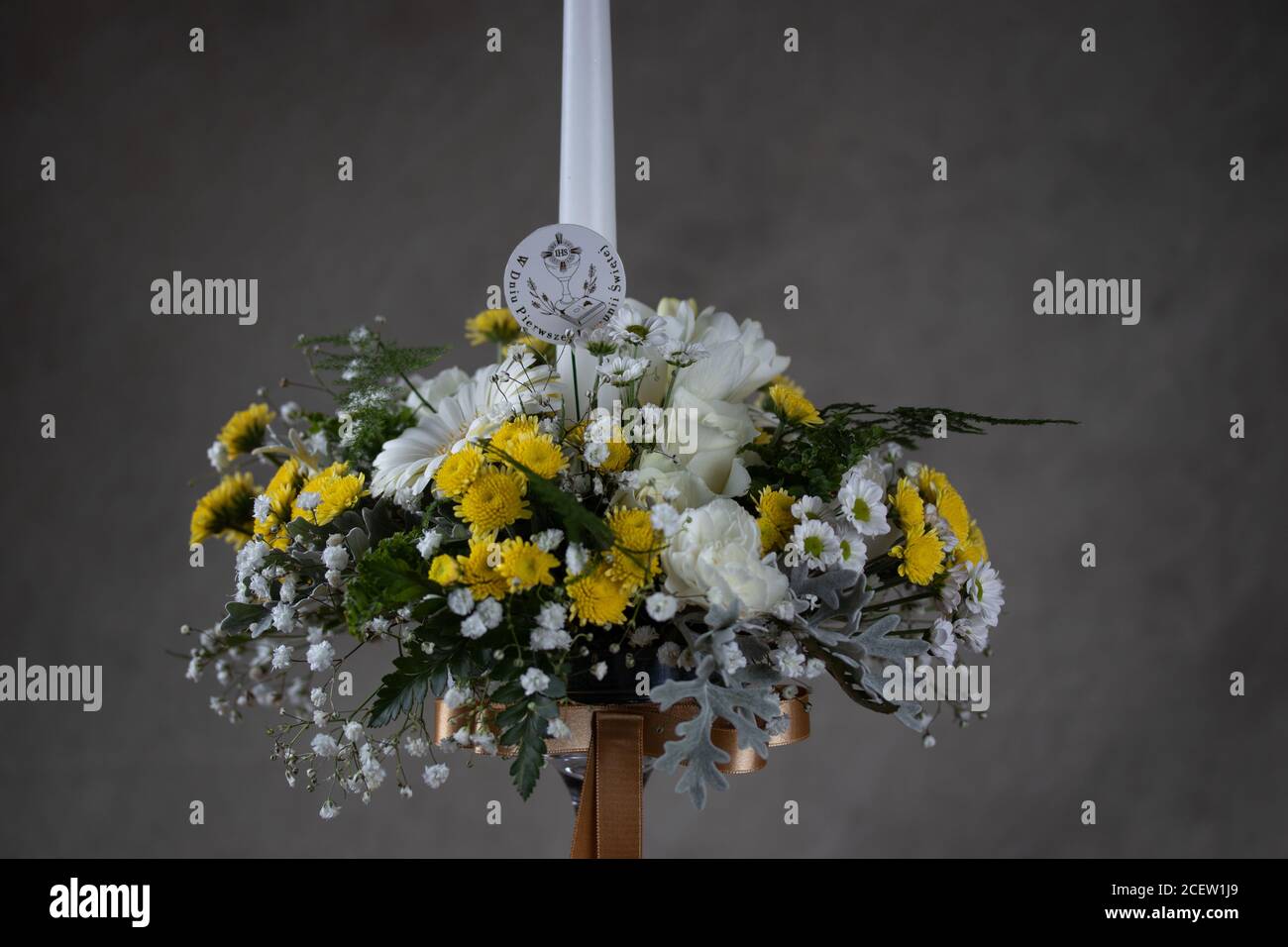 First holy communion flower bouquets. White candle decorated with white ...