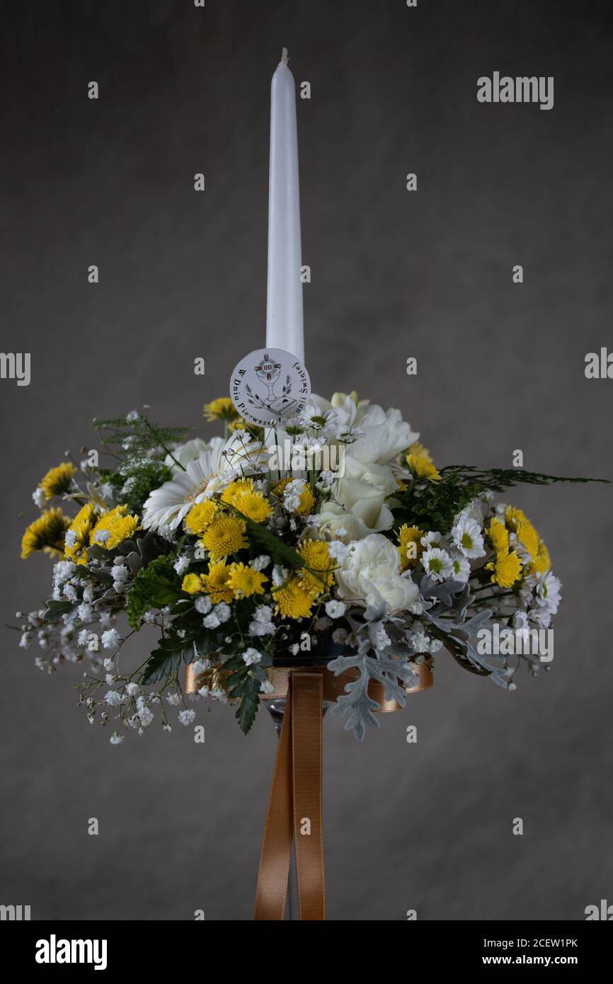 First holy communion flower bouquets. White candle decorated with white ...