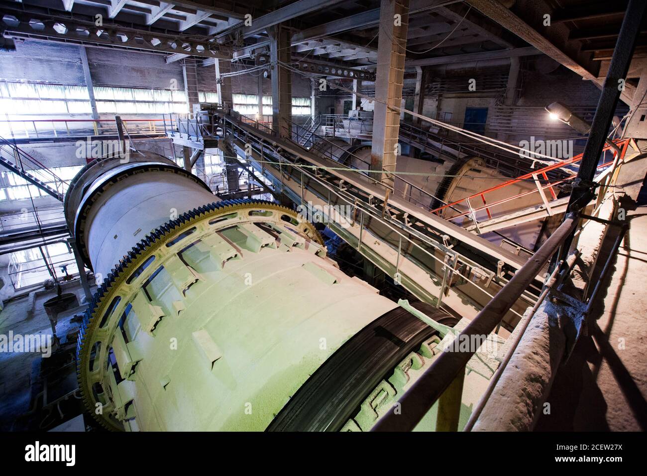 Grey factory ball mill in factory workshop of phosphoric fertilizers ...