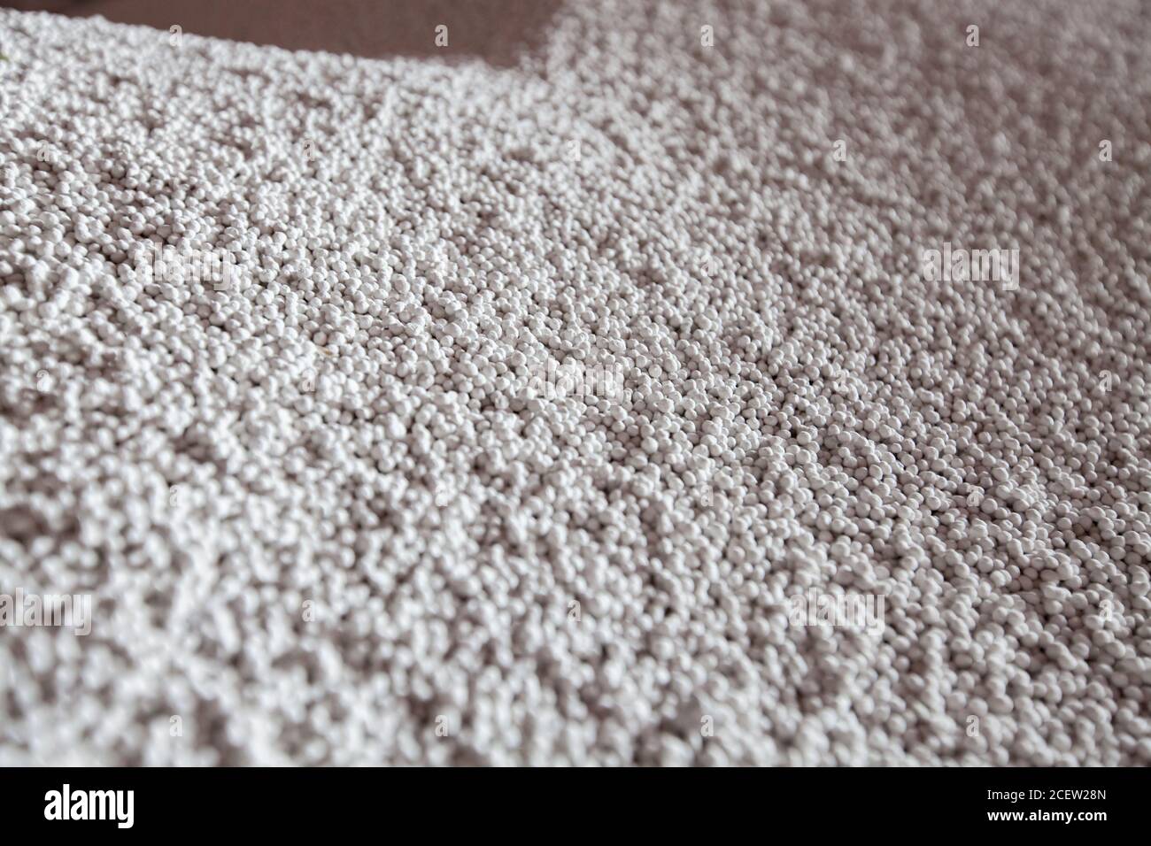 White granules (pellets) of phosphoric (phosphate) fertilizers on ...
