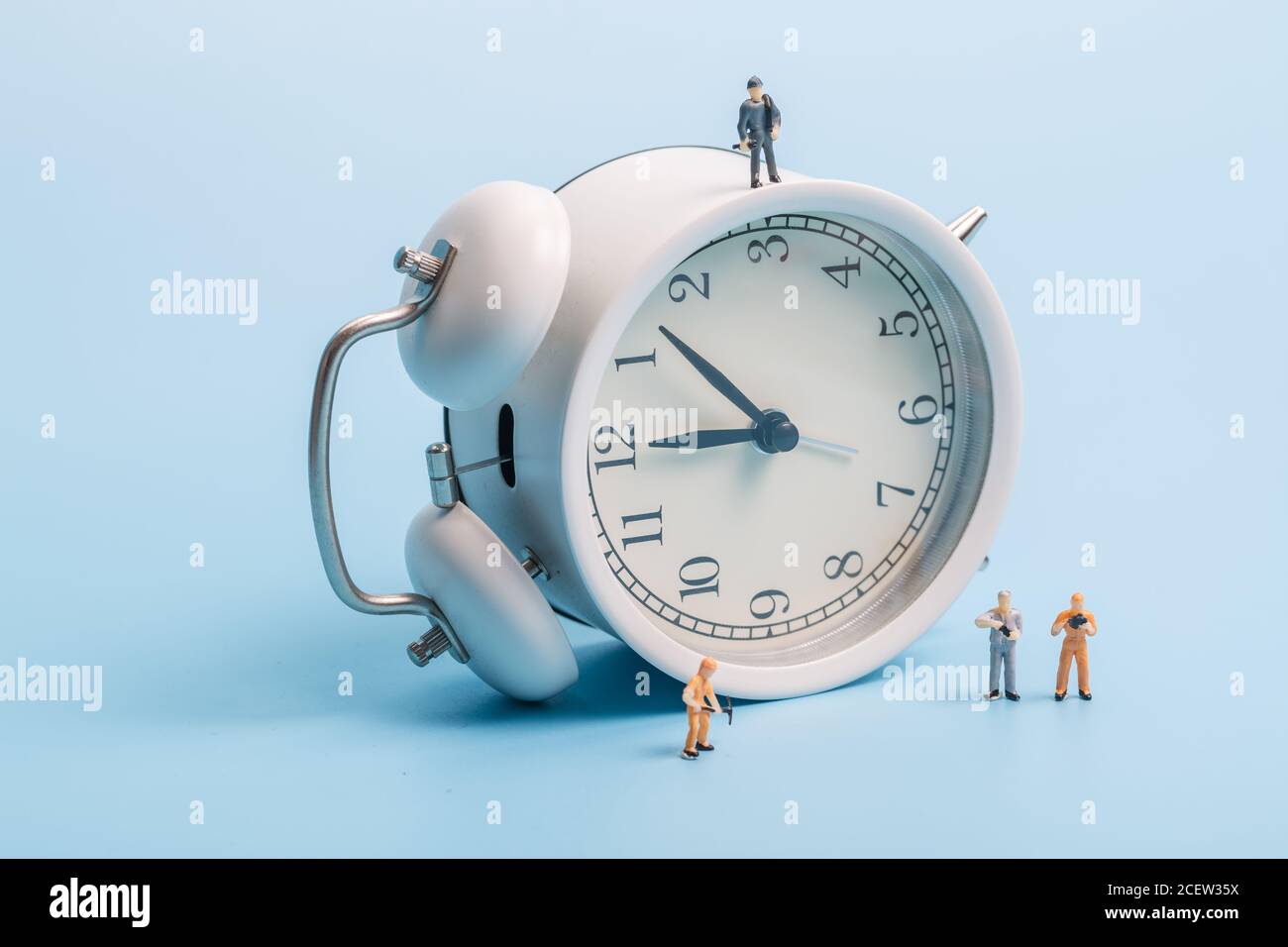Clock worker hi-res stock photography and images - Alamy