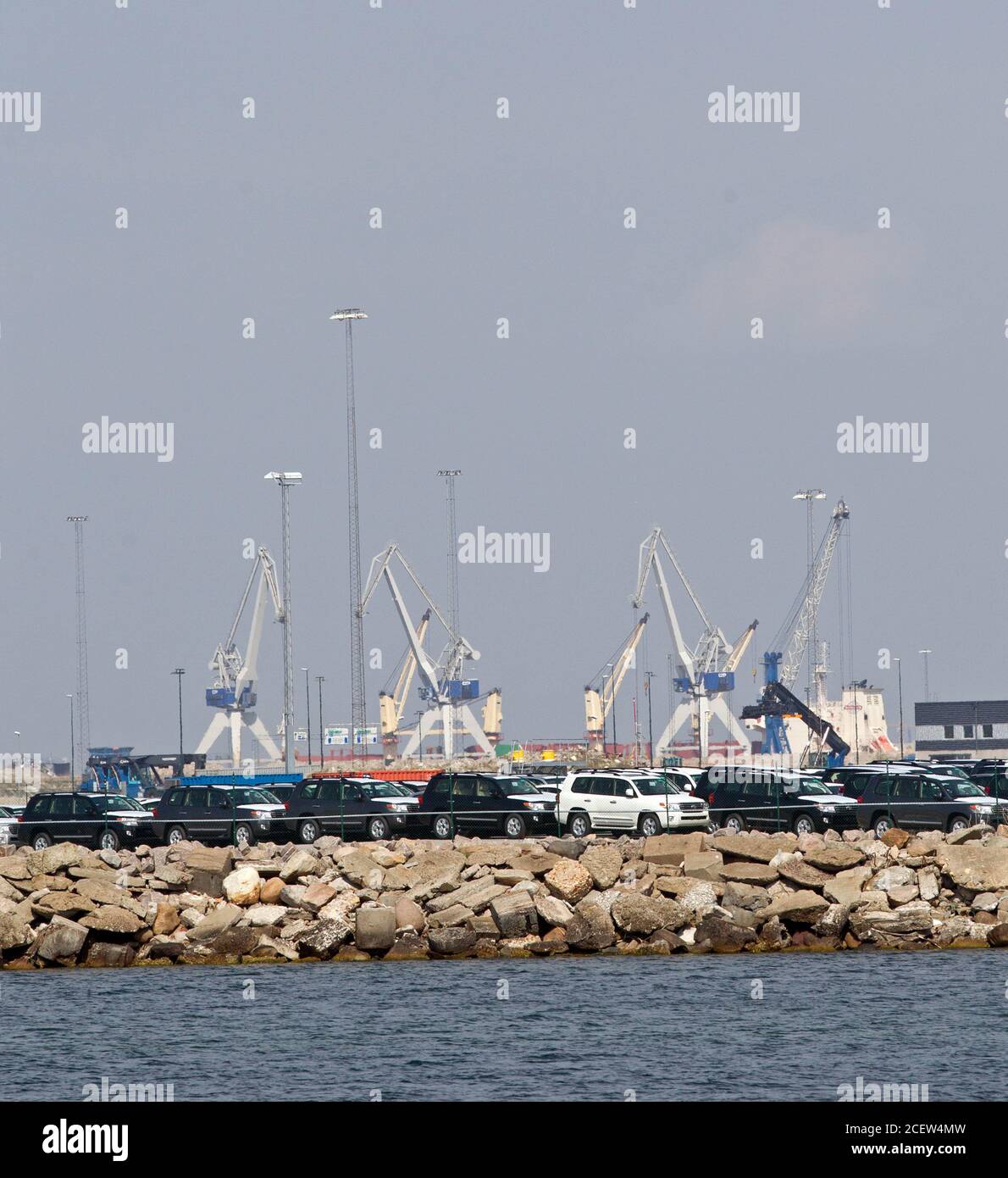 Cranes, containers and imported cars in Västra hamnen, Malmö. Photo ...