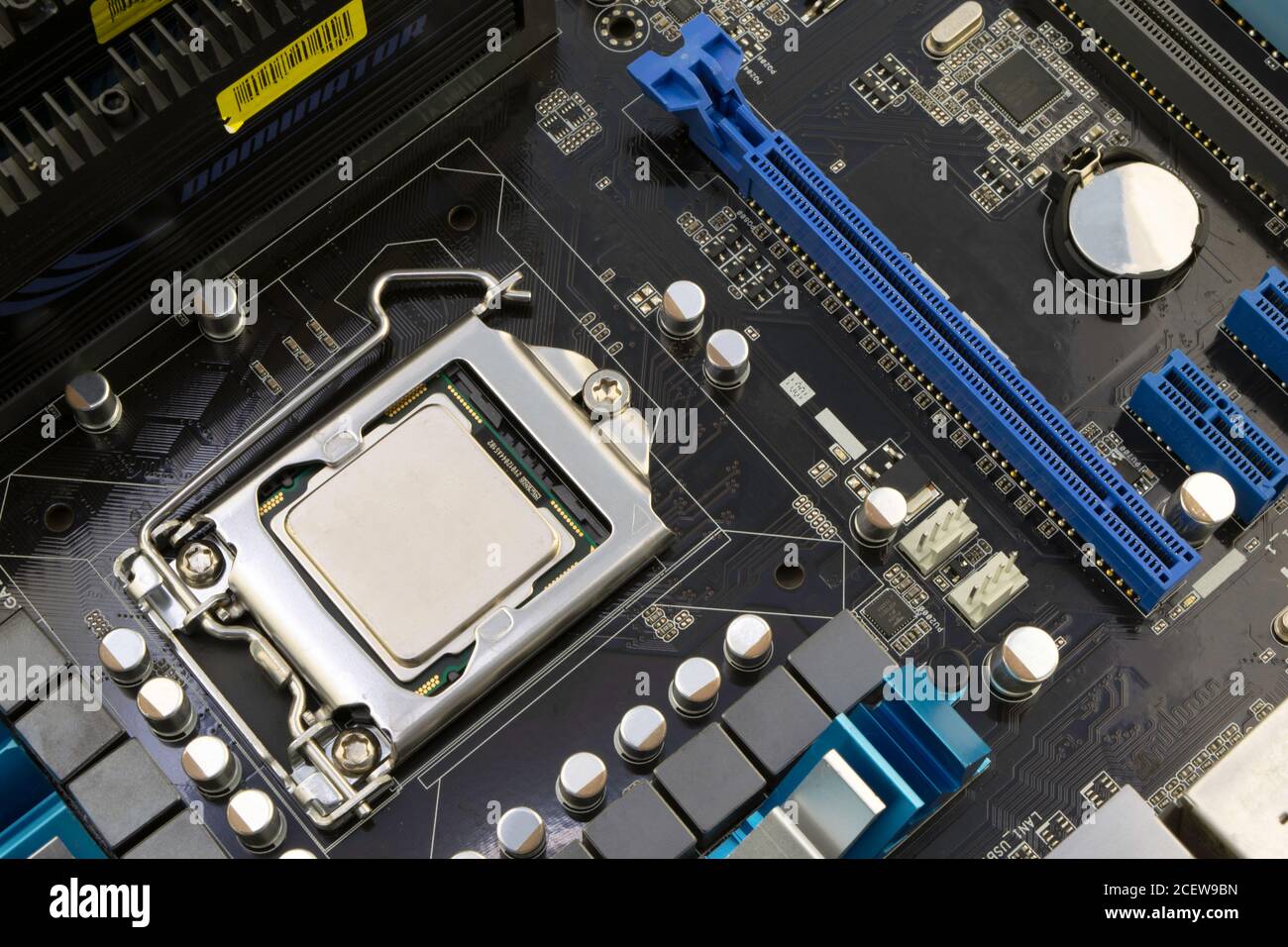 computer motherboard, with processor and other parts installed on it ...