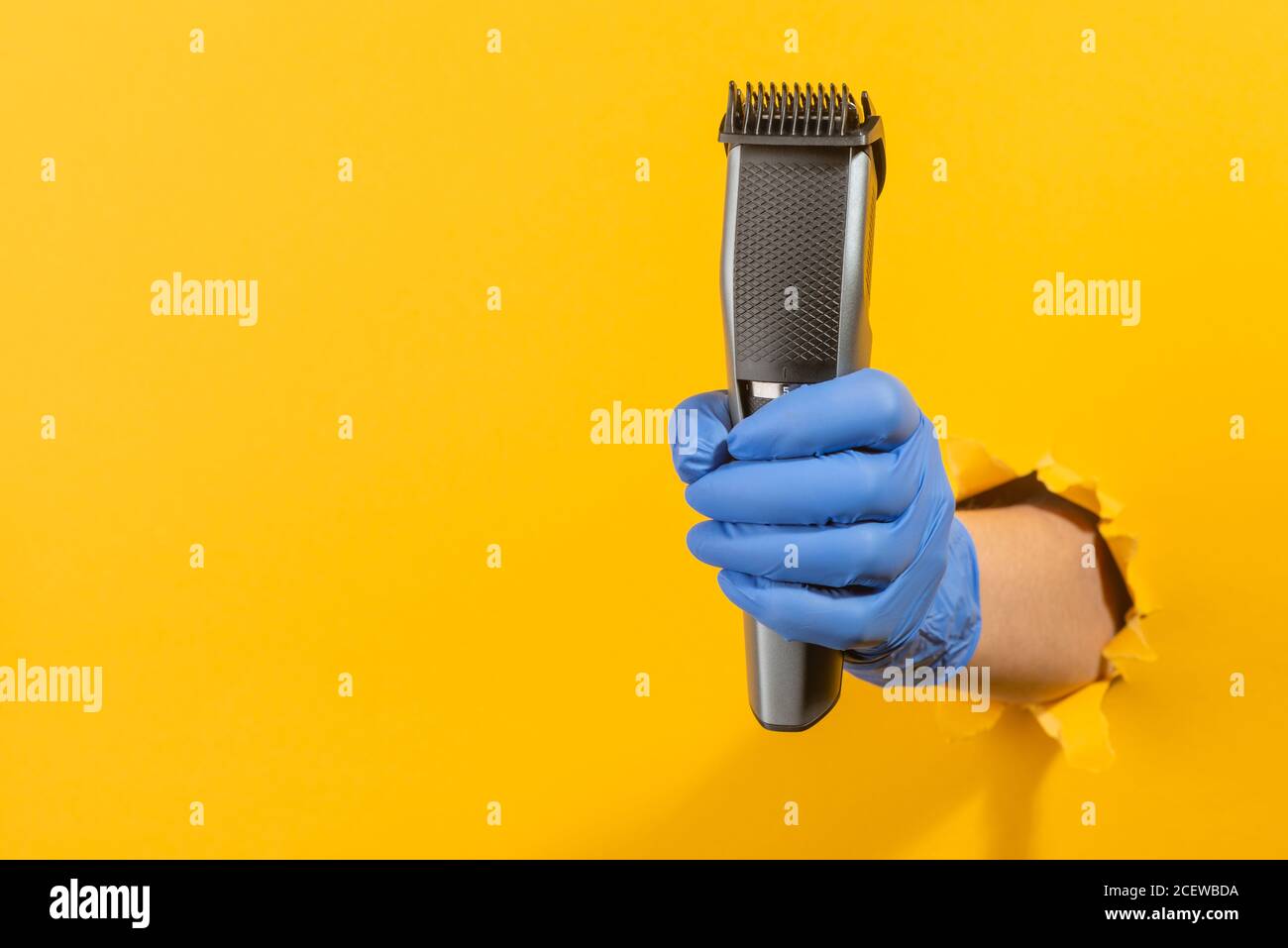 Hand holding electric shaver hi-res stock photography and images - Alamy