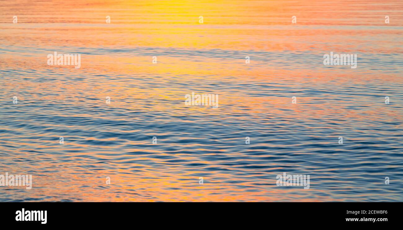 Clear water texture in blue and orange. Background of the ocean and the ...
