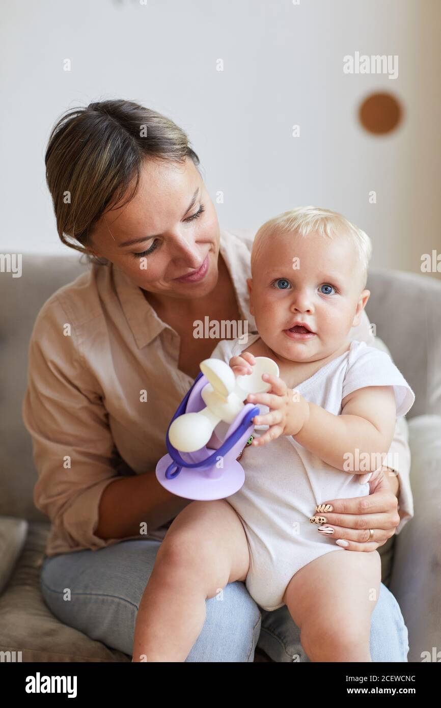 Mother holding child on lap hi-res stock photography and images - Alamy
