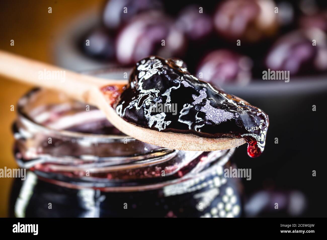 jabuticaba (or jaboticaba) jelly, close-up on wooden spoon, grape from ...