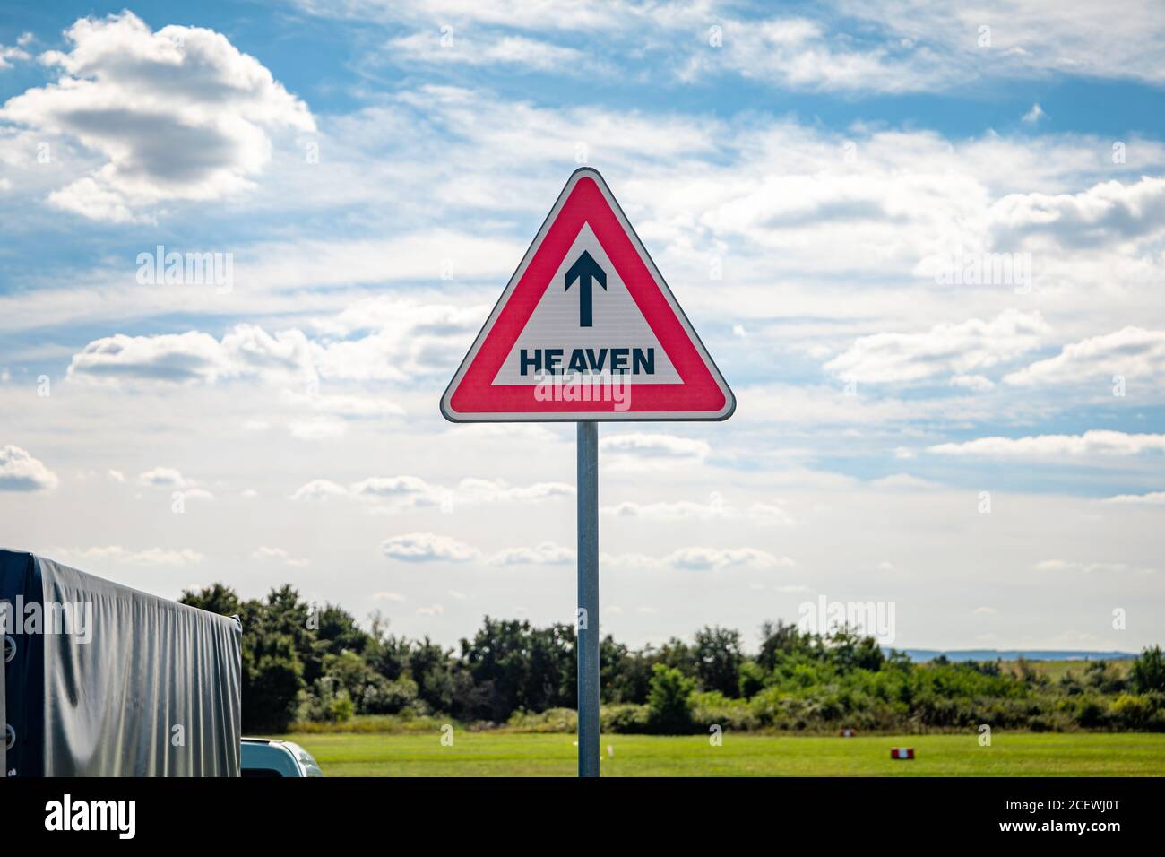 Roadsign with an arrow inside pointing to heaven Stock Photo - Alamy