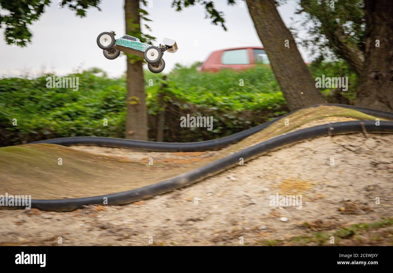 Offroad RC buggy driving on an outdoor dirt track Stock Photo - Alamy
