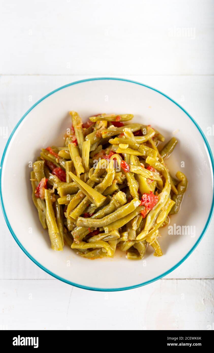 Turkish Green Beans (Fasoulia) in dish on white background Stock Photo ...