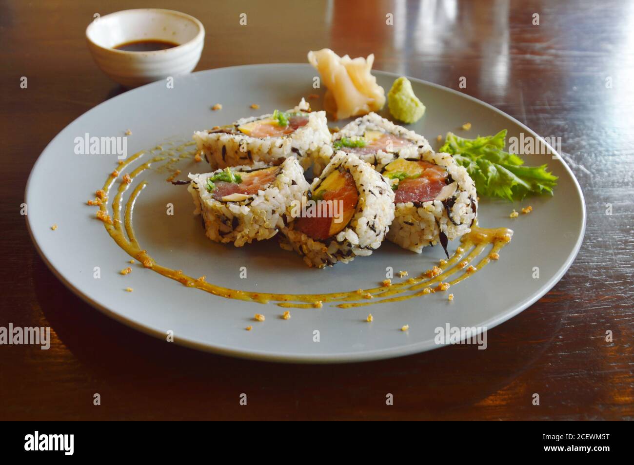 sushi roll stuffed tuna and pickled cucumber slice on plate Stock Photo ...