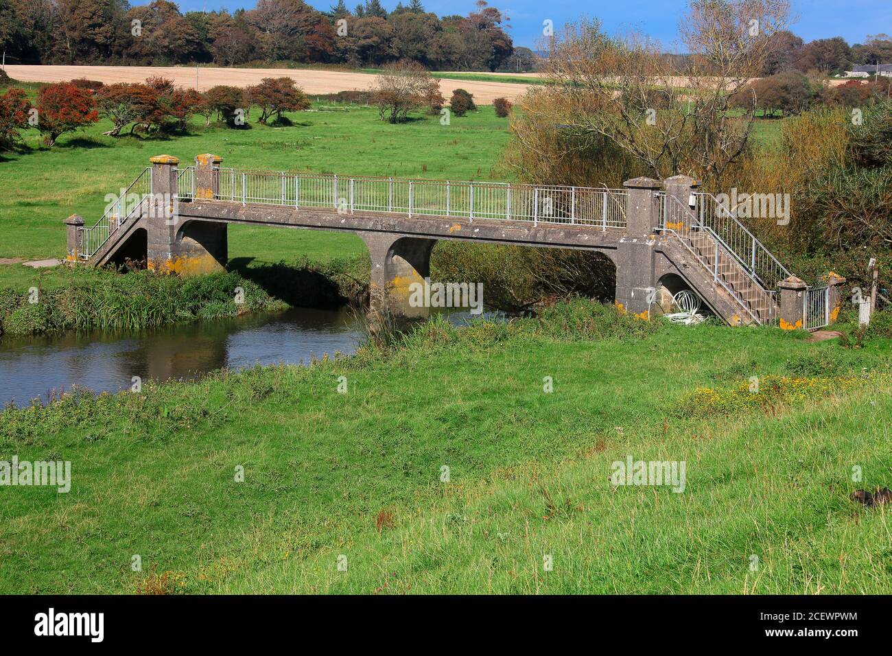 An old but nice condition concrete foot bridge that crosses the Ewenny ...