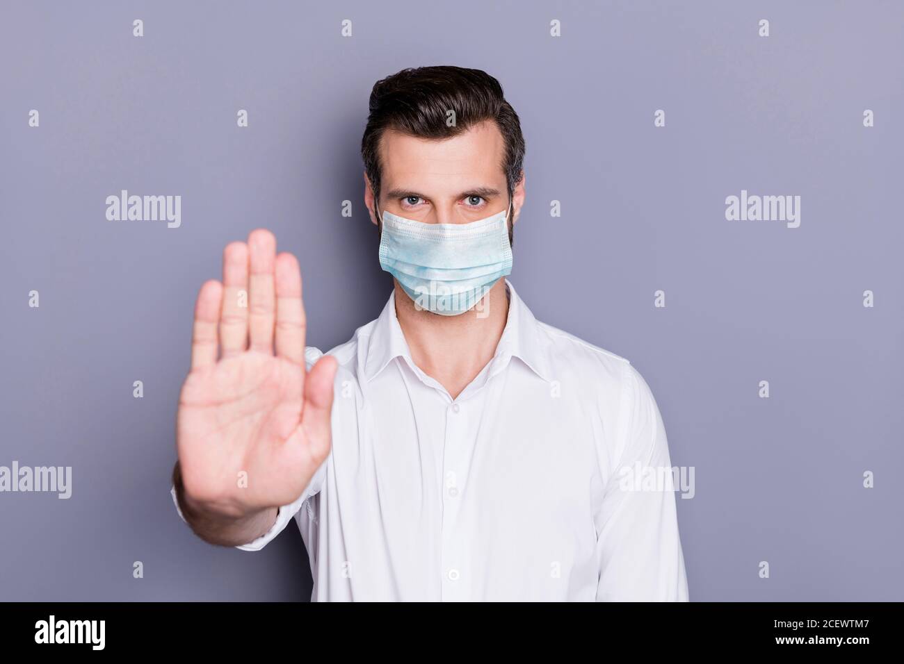Close-up portrait of his he attractive healthy strict guy medic wearing ...