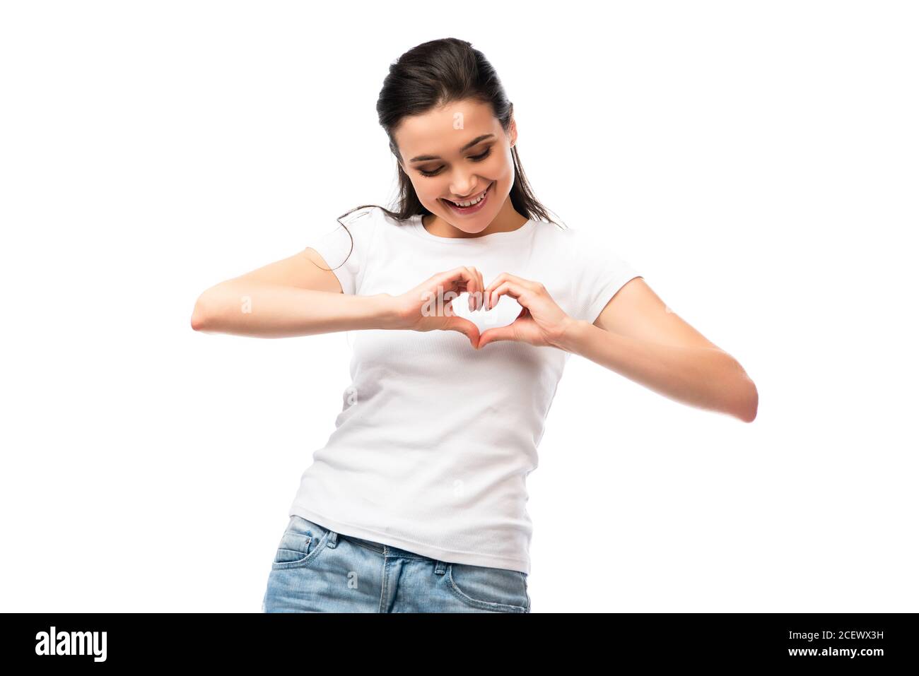 young woman showing heart sign with hands isolated on white Stock Photo ...