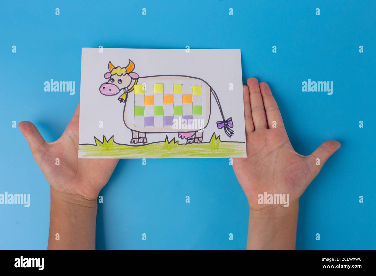 kids hands holding paper craft, DIY, tutorial, kindergarten or school ...