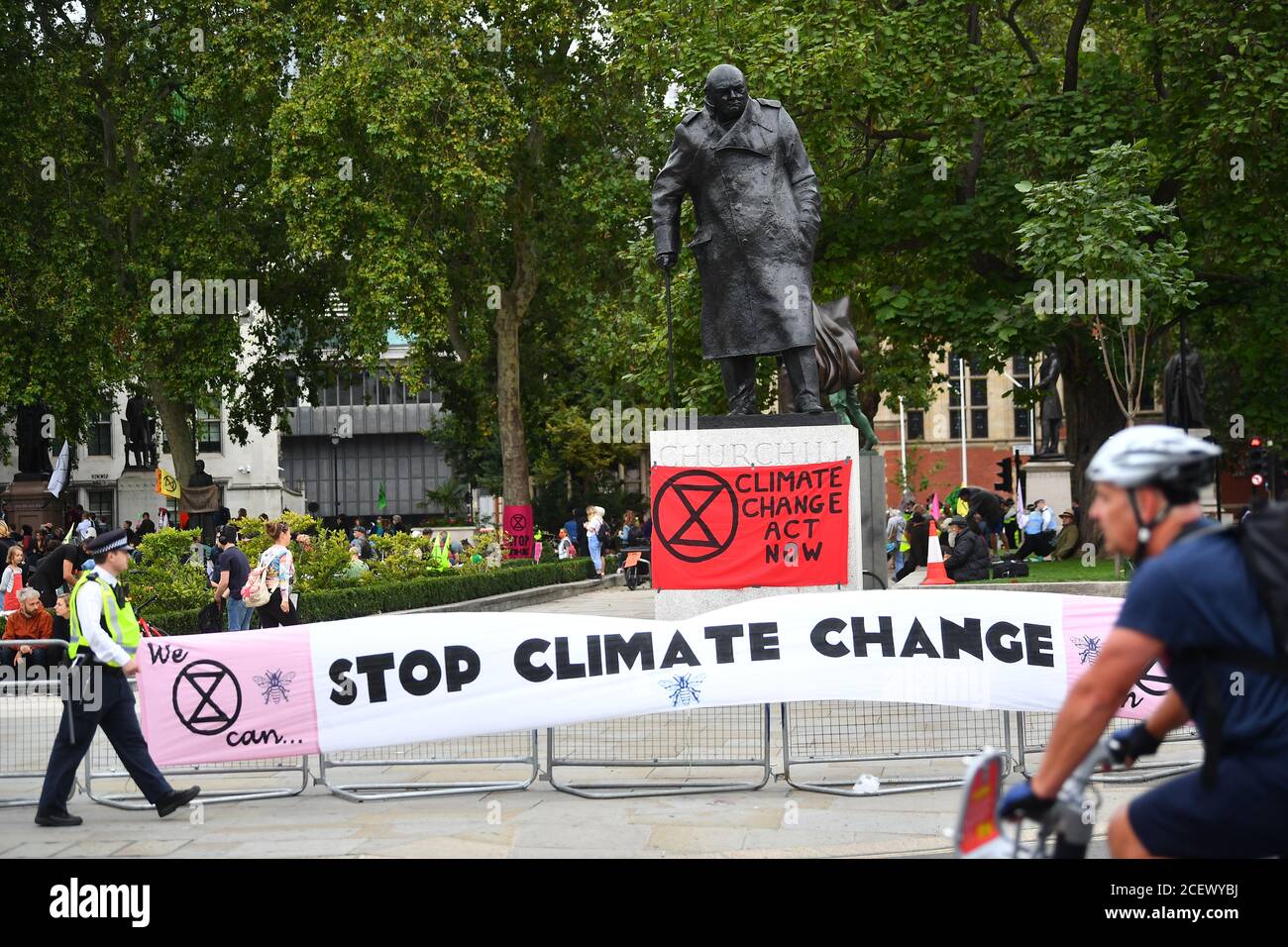 Extinction Rebellion posters on the statue of Winston Churchill at ...