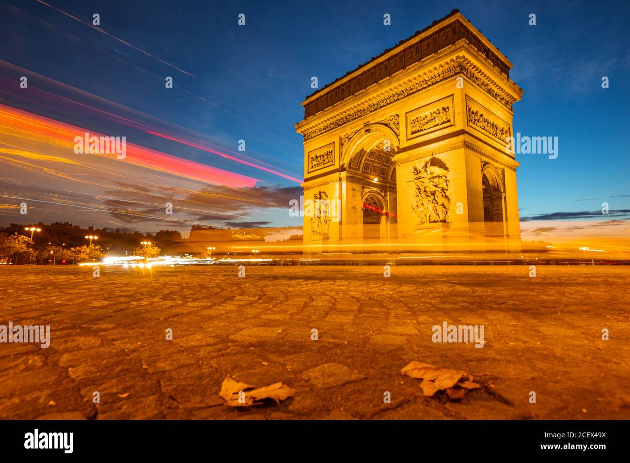 Sunset view of Arc de Triomphe and the traffic in Paris, France Stock ...