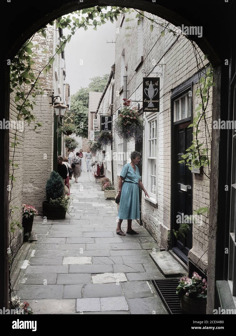 Window shopping in The Ginnel, Market Place, Devizes, Wiltshire. Circa ...