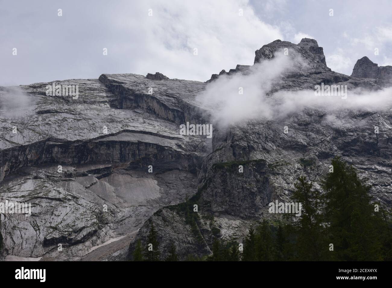 Slabs of gray rock wet with rain on the mountains of Val d'Oten Stock ...