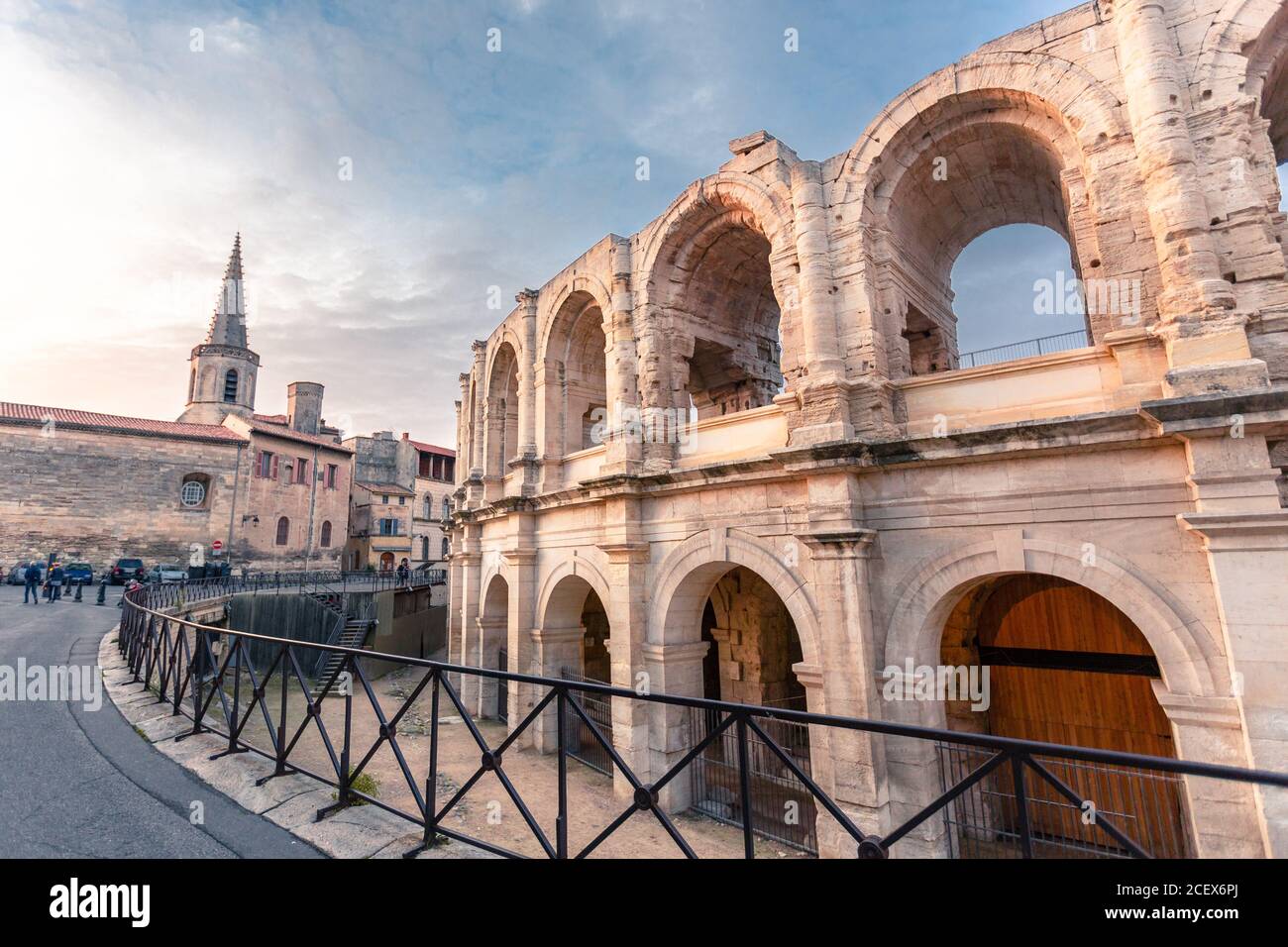 The street view of the roman ruins in Arles, Provence, at sunset Stock ...