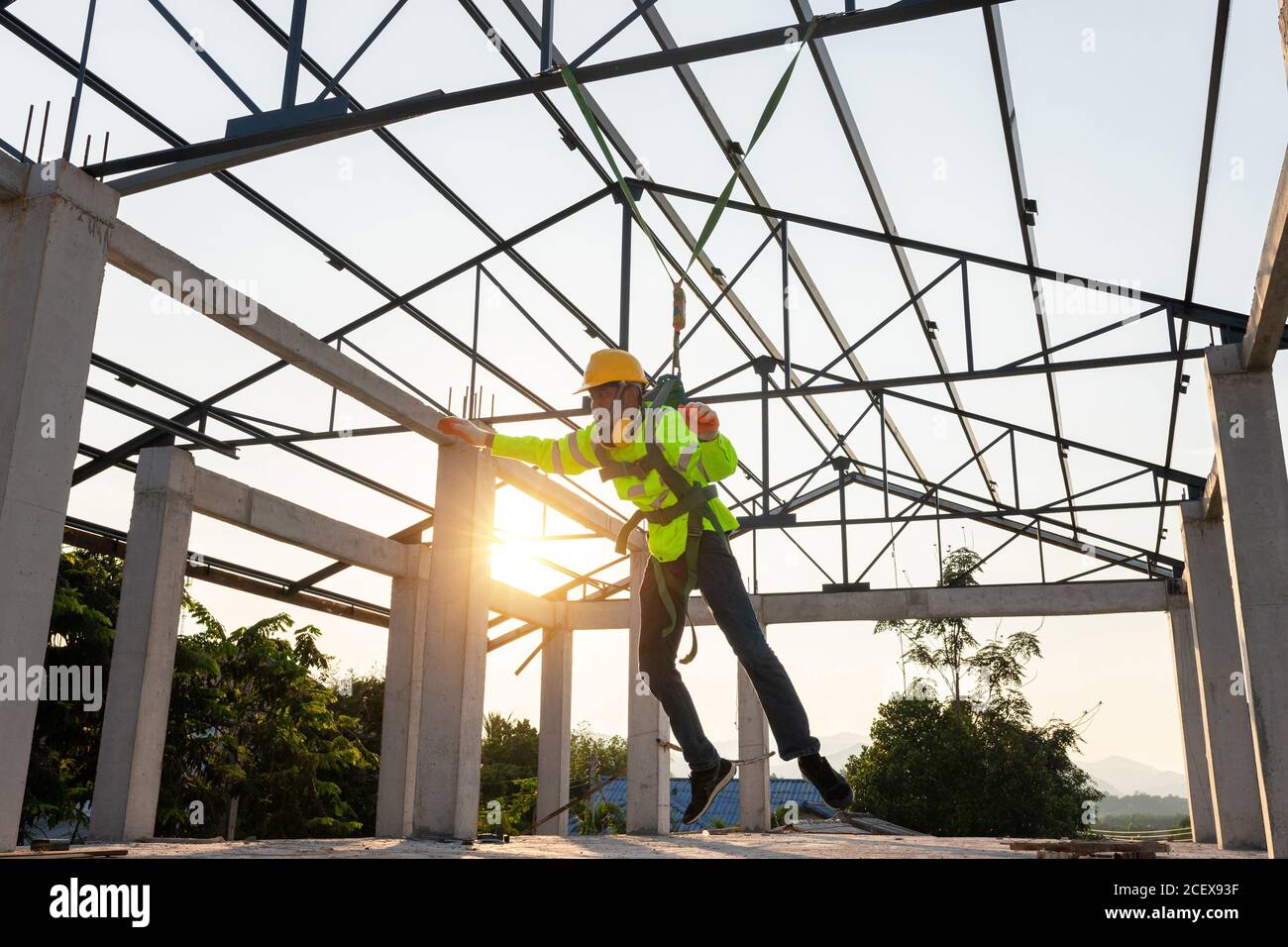 Construction workers fall from a height but have safety to help ...