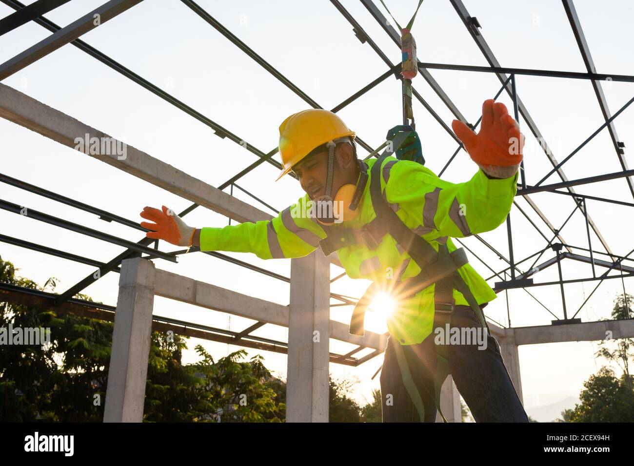 Construction workers fall from a height but have safety to help ...