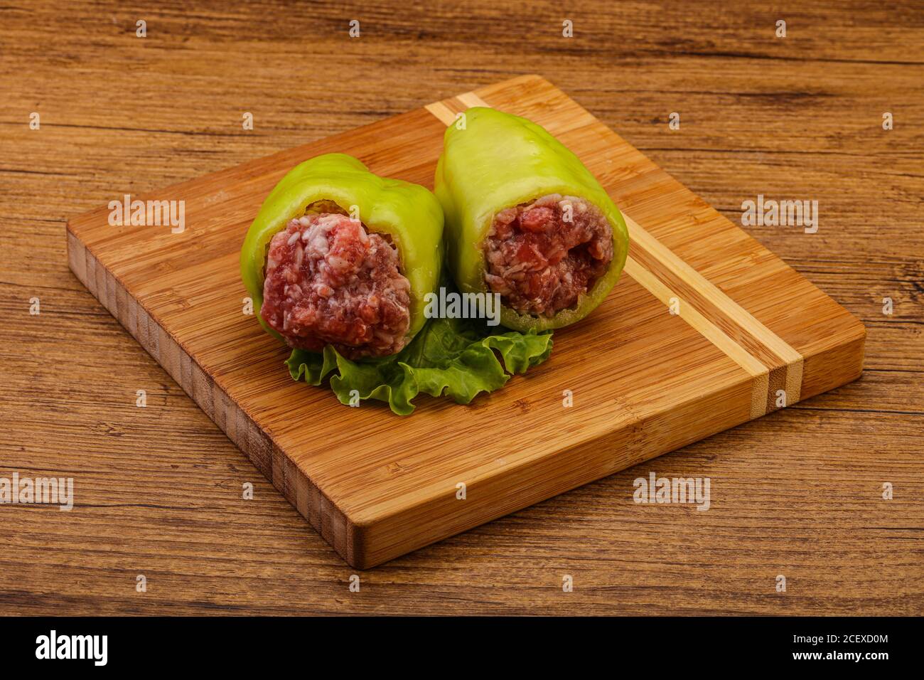 Raw stuffed green bell pepper with meat Stock Photo - Alamy