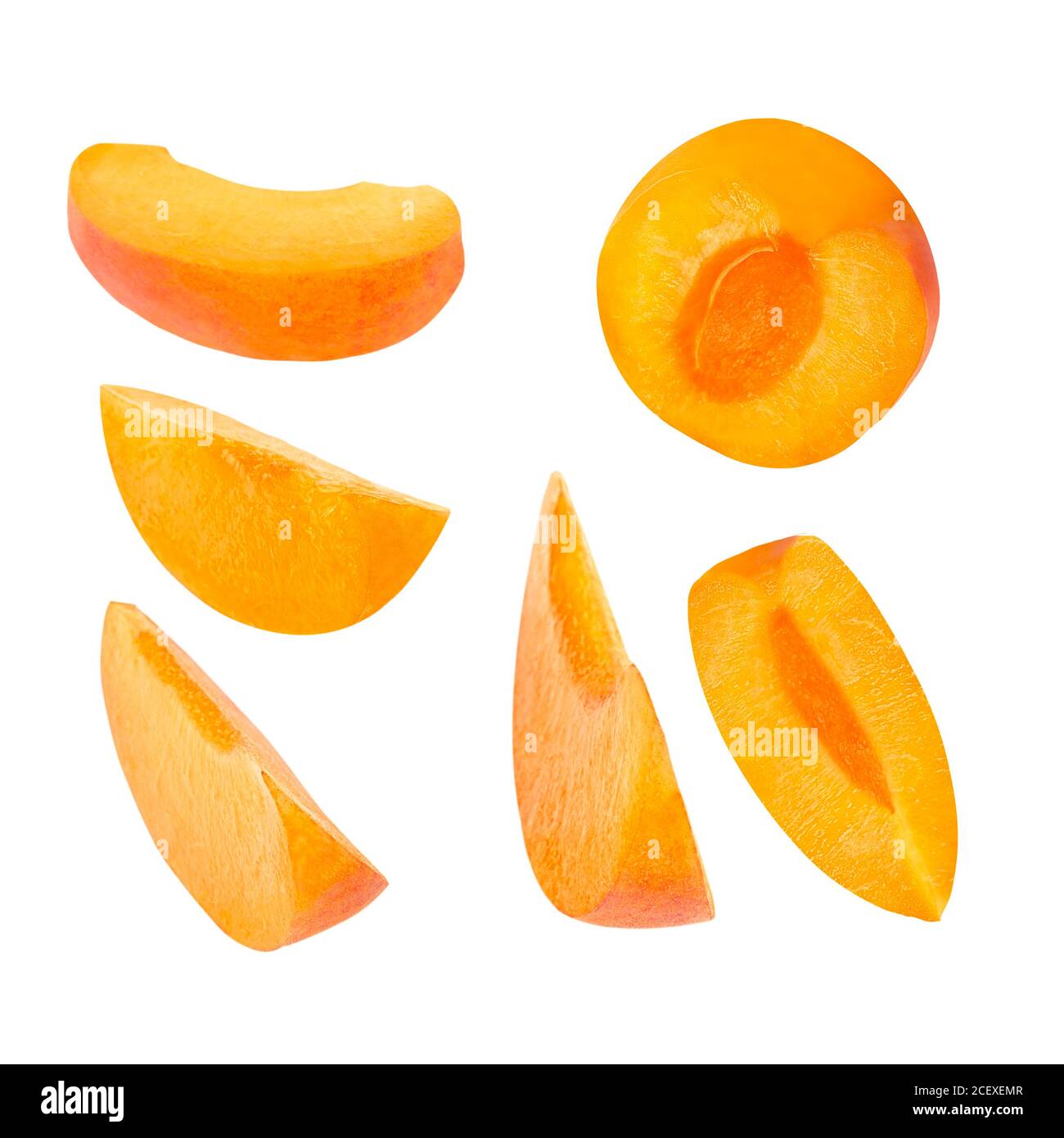 Apricot slices set isolated on white background Stock Photo - Alamy