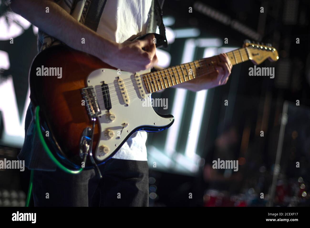 The artist plays the guitar. Rock band at a concert Stock Photo - Alamy