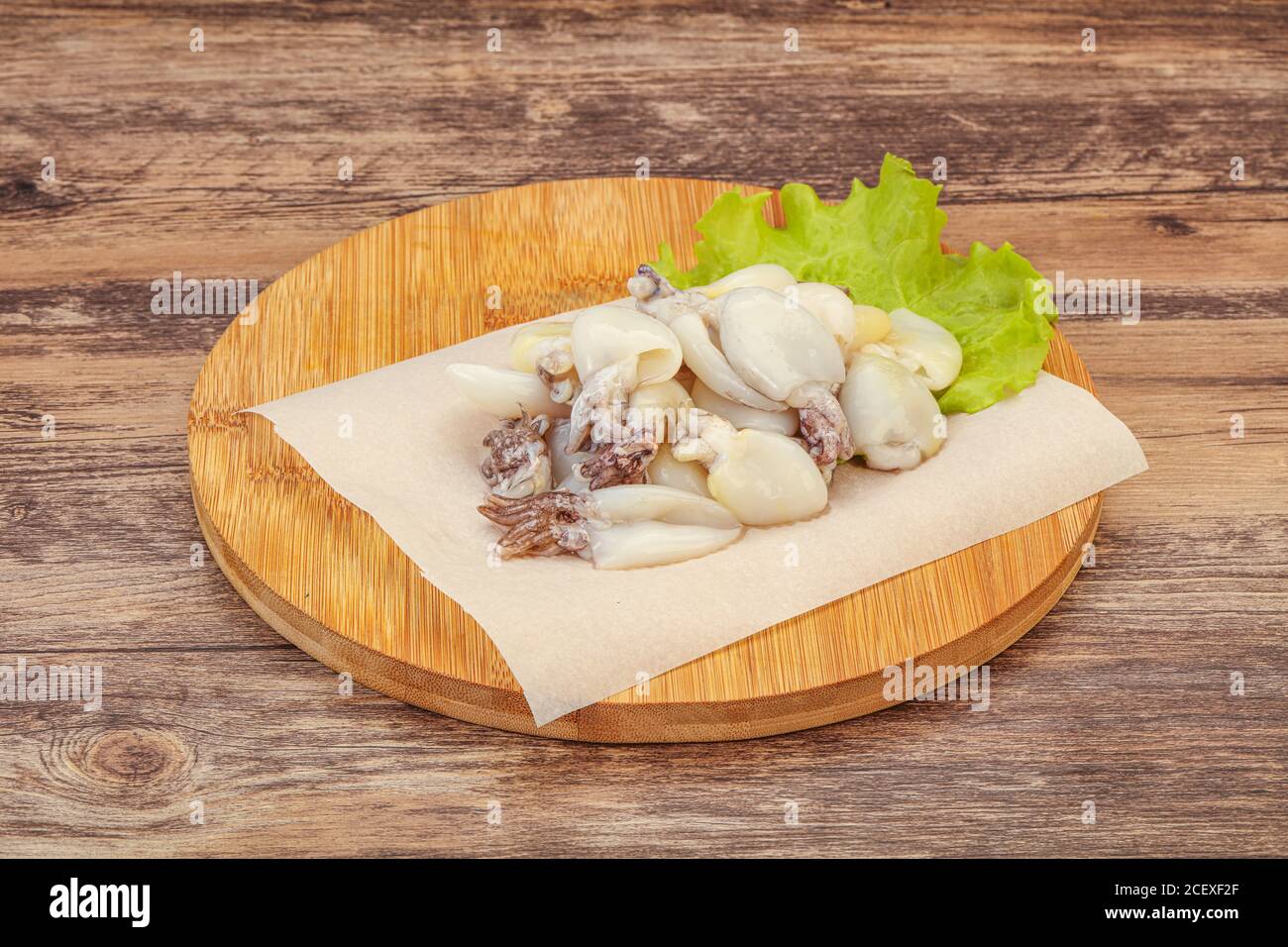Raw seafood - cuttlefish for cooking over board Stock Photo - Alamy