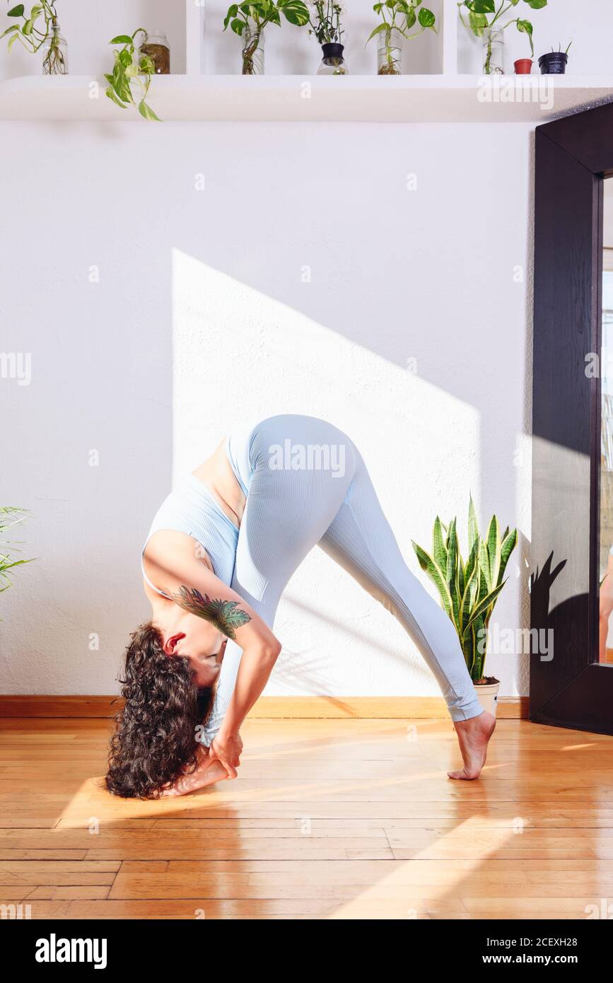 Standing forward bend pose hi-res stock photography and images - Alamy