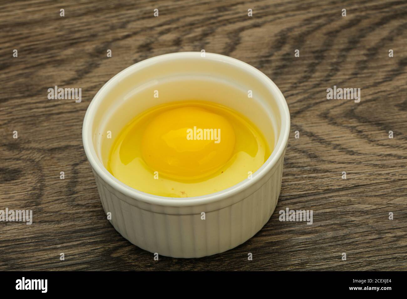 Raw Chicken egg in the bowl for cooking Stock Photo - Alamy