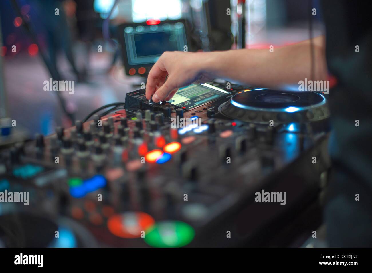 DJ mixing console. Tune in before a concert Stock Photo - Alamy