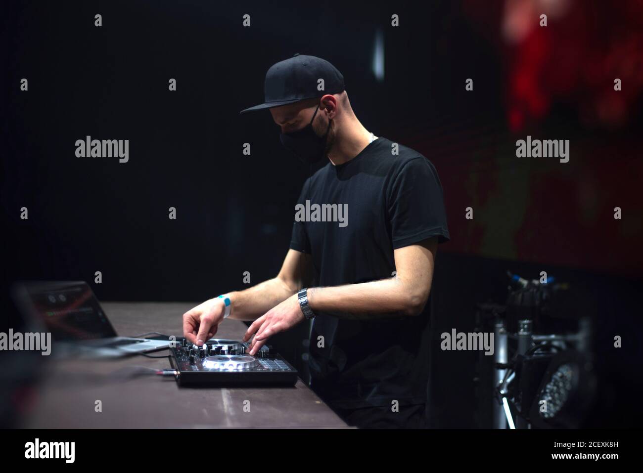 masked DJ playing music at a pandemic party Stock Photo - Alamy