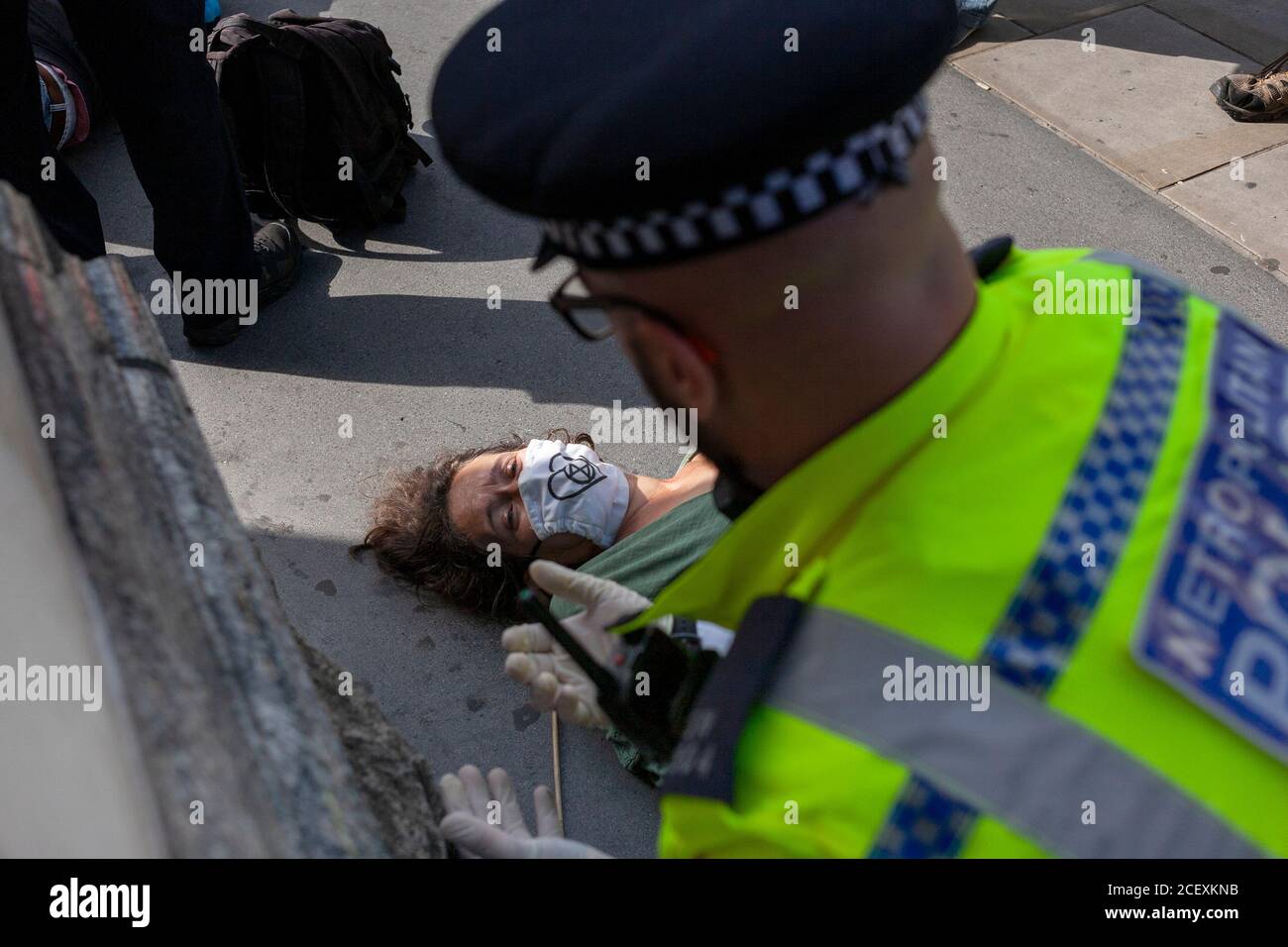 A police officer in conversation with an Extinction Rebellion protester ...