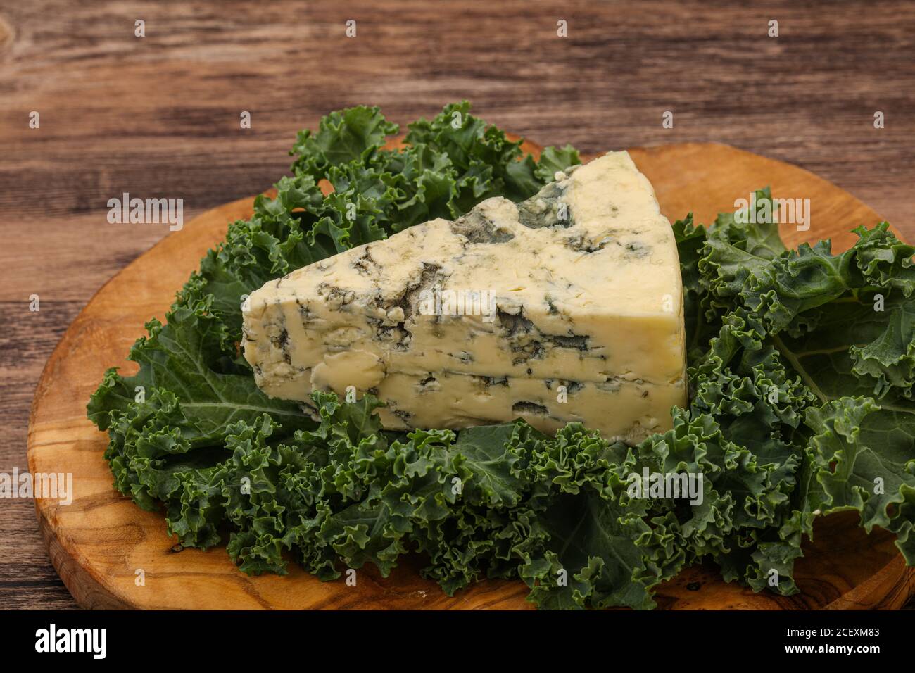 Dairy Blue cheese triangle with mold Stock Photo - Alamy
