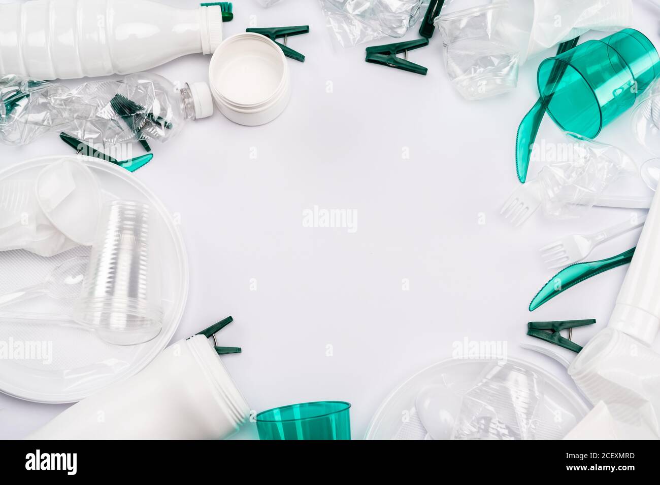 top view of plastic rubbish scattered on white background with copy ...