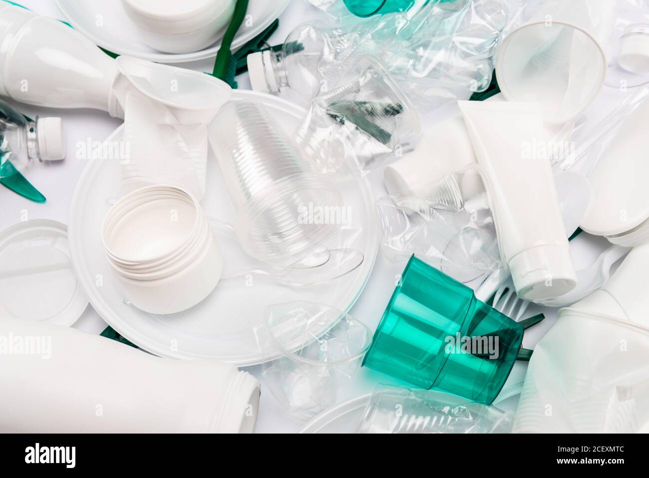 top view of plastic garbage scattered on white background Stock Photo ...