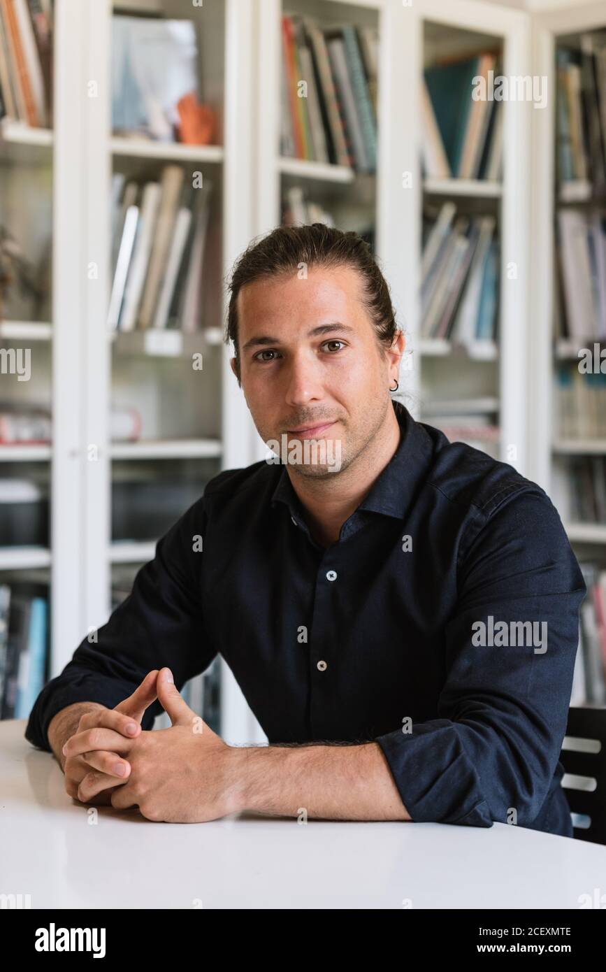 Handsome respectable businessman sitting desk hi-res stock photography ...