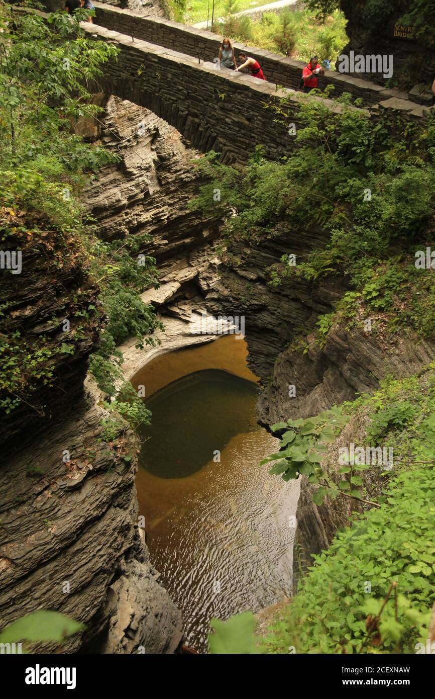 Visitors looking down from the Sentry Bridge at Watkins Glen State Park ...