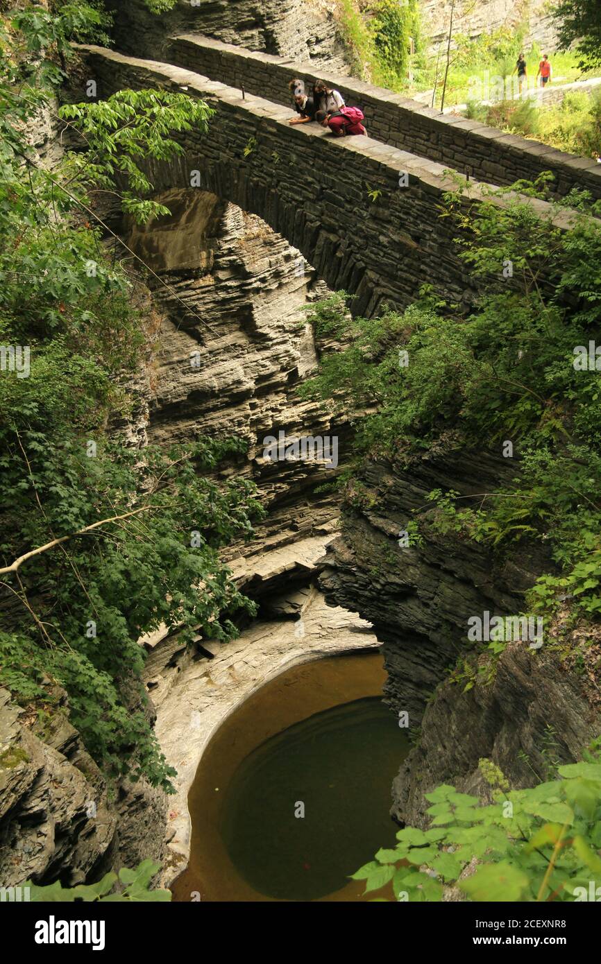 Visitors looking down from the Sentry Bridge at Watkins Glen State Park ...