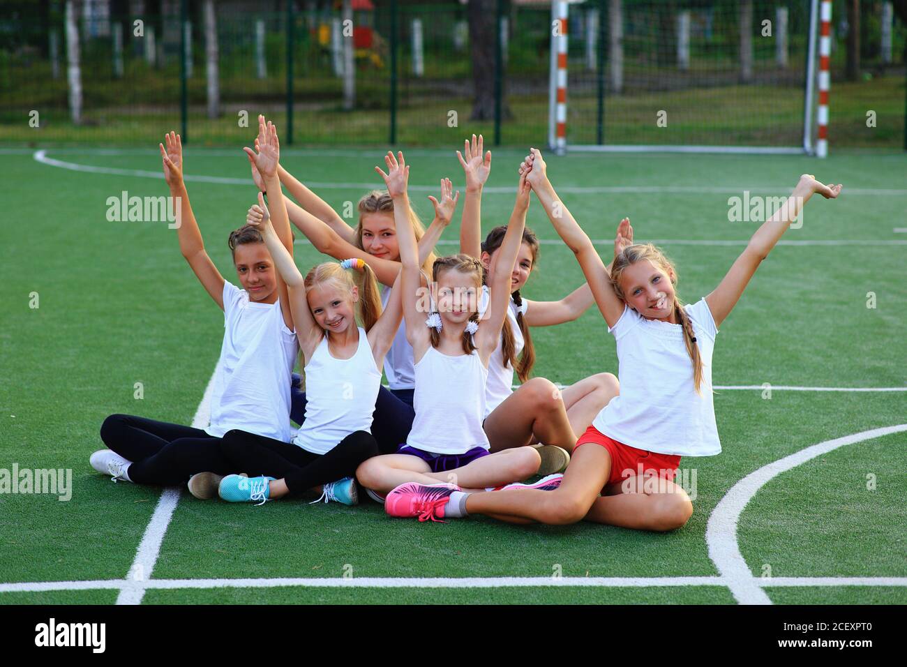 Portrait girls sitting field hi-res stock photography and images - Alamy